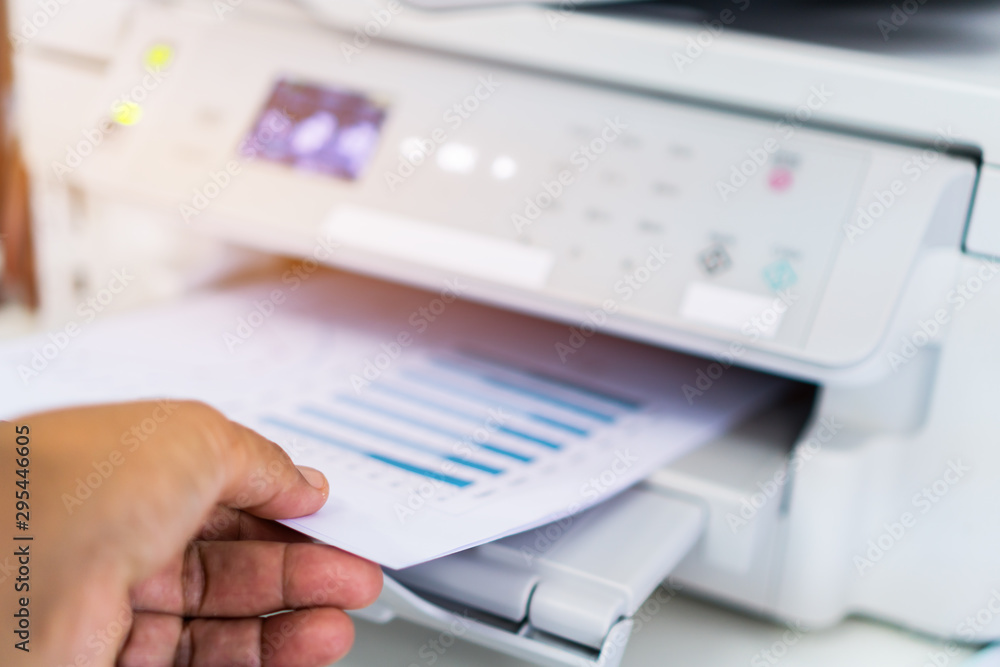 Business printer / printing documents in office concept:Businessman ...