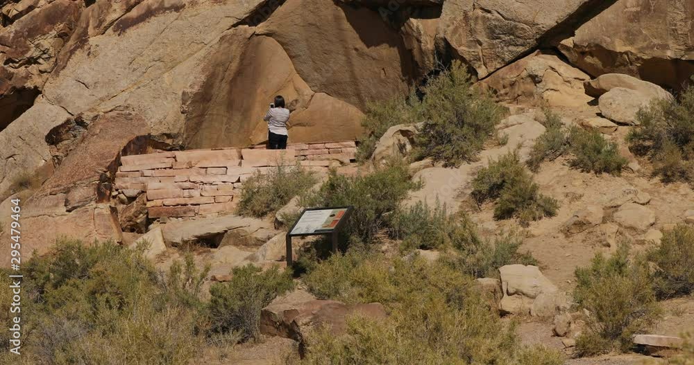 Vídeo do Stock: Woman explores Indian village ancient rock art Utah ...