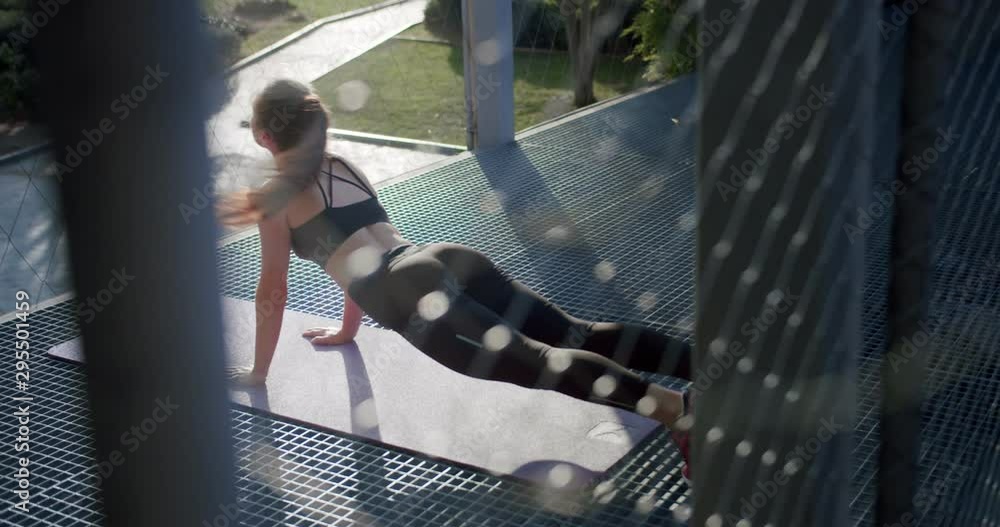 Back shoot of amazing body shape of young powerful female practicing ...