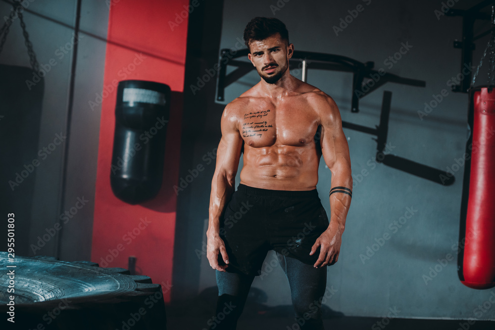 Professional bodybuilding man posing in front of the camera showing his ...