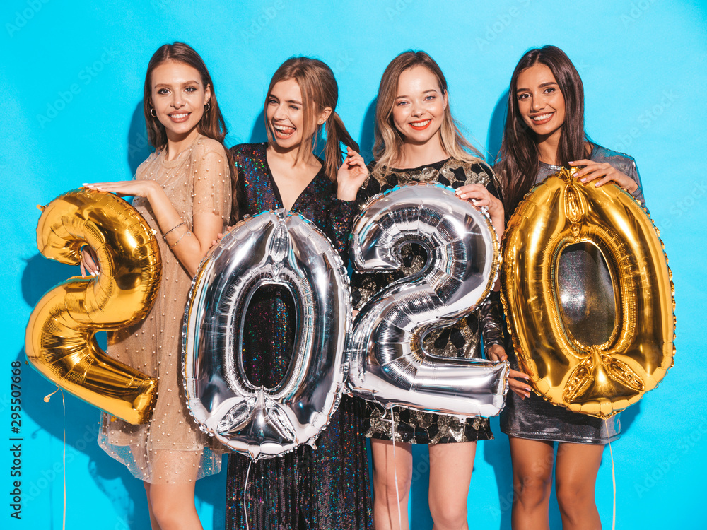 Beautiful Women Celebrating New Year Happy Gorgeous Girls In Stylish Sexy Party Dresses Holding