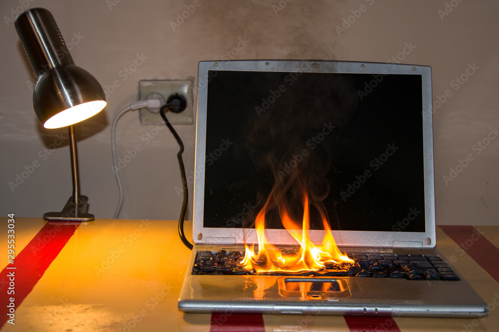 In the room on the table the laptop caught fire, the ignition of the ...