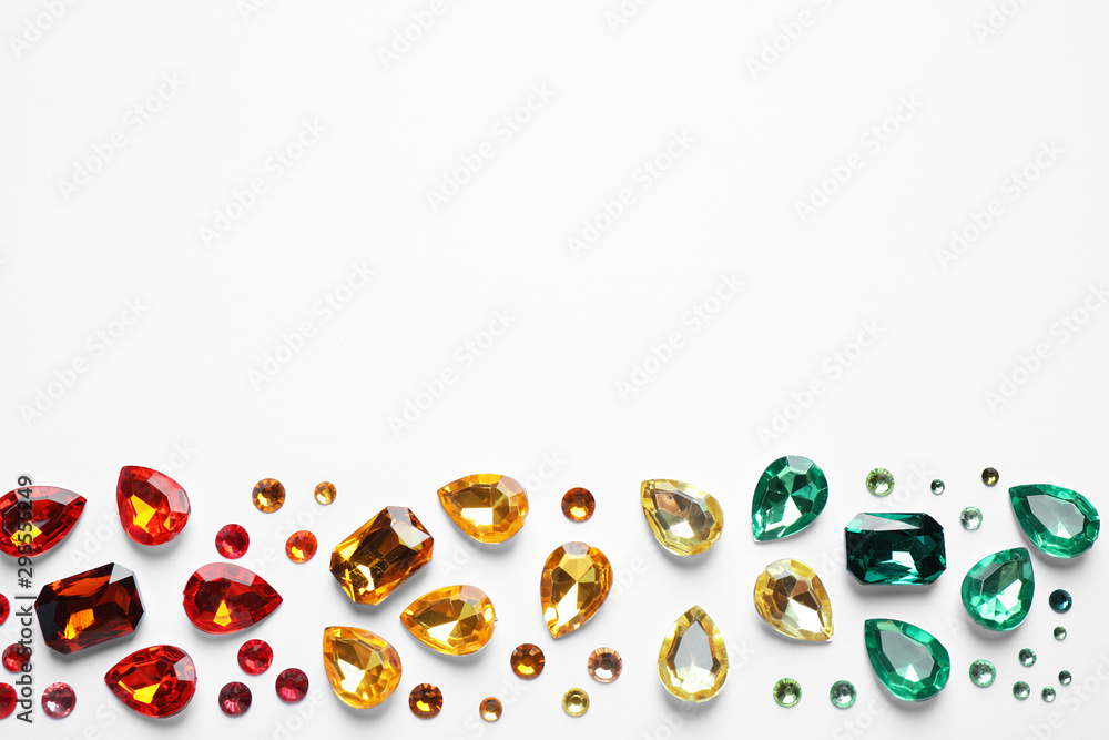 Different beautiful gemstones on white background, top view Stock Photo ...