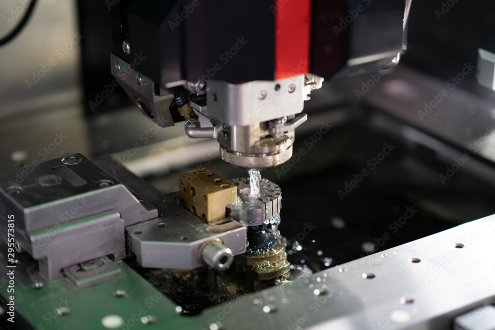 CNC wire cut machine cutting mold parts Stock Photo | Adobe Stock