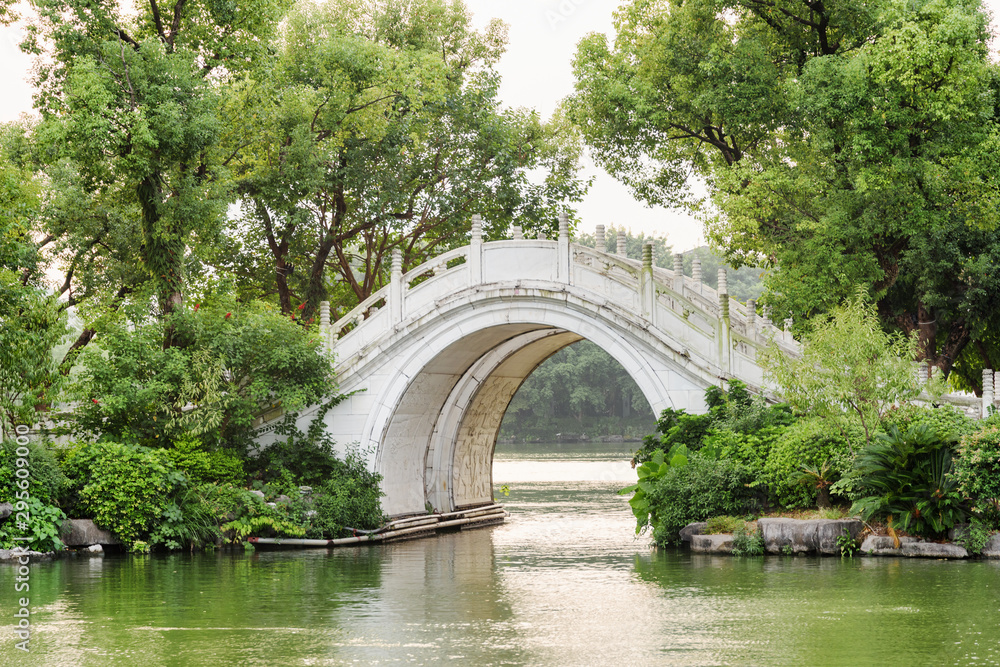 Evening view of white twin marble bridge on lake. Guilin Stock Photo ...