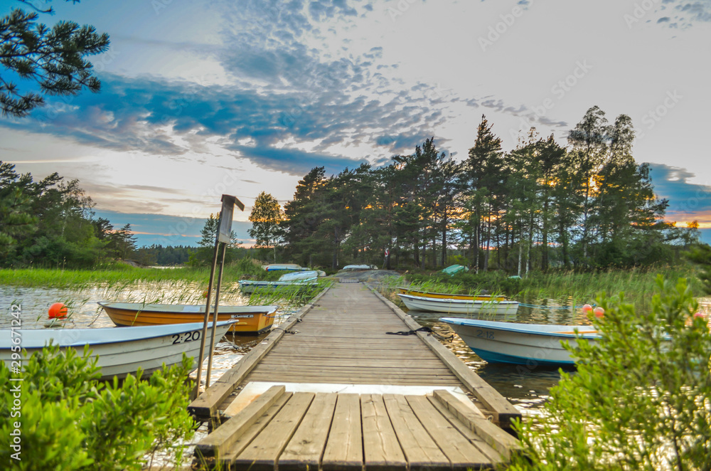 Peaceful cloud landscape above the forest side in Sweden with wooden ...