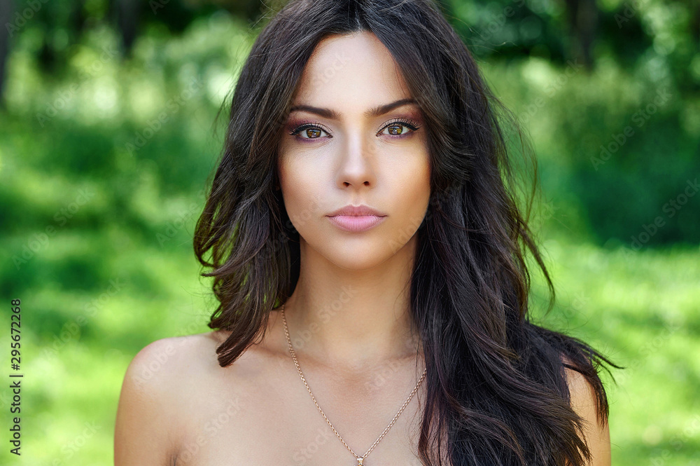 Beautiful woman face with perfect skin. Close up portrait on nature ...