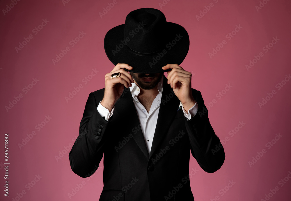 Handsome young man taking off his hat and greeting Stock Photo | Adobe ...
