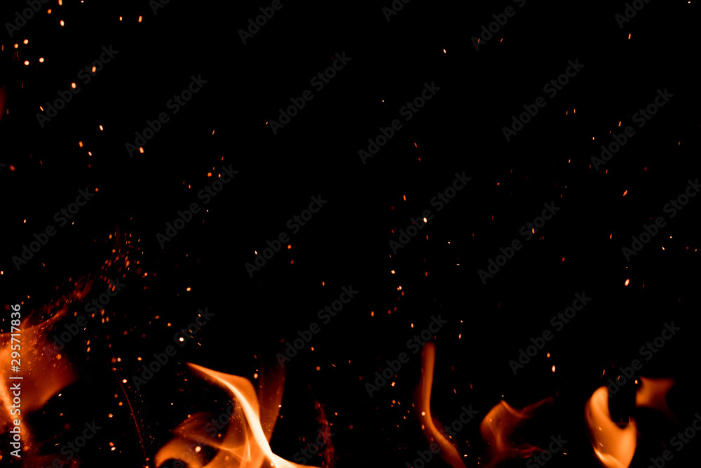 Fire sparks with flame against black background; great for overlay ...