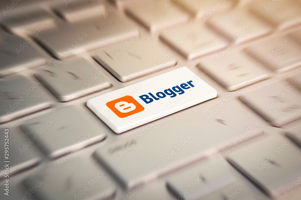 button with the company logo blogger on the grey keyboard of a modern ...