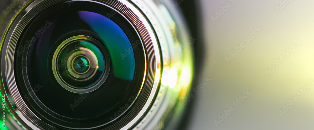 Banner. The camera lens and yellow backlighting. A beam of yellow on a ...
