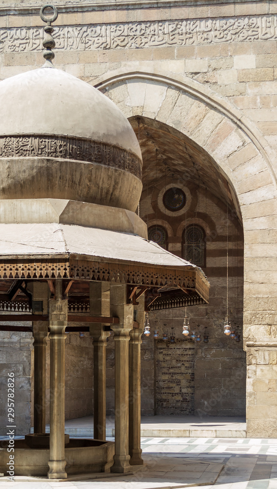 Ablution fountain at historic Sultan Barquq Mosque with huge arch in ...