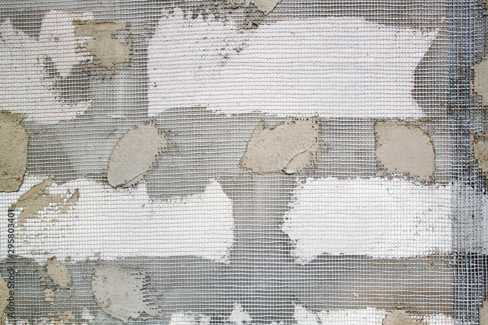 surface of wall with applied construction grid for plaster application ...