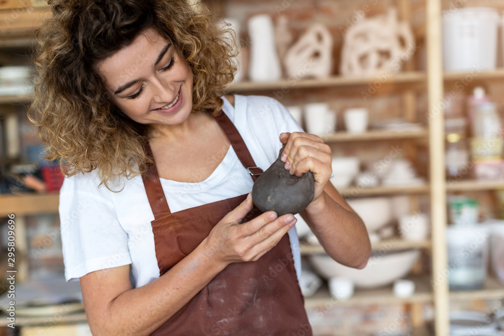 Woman pottery artist makes ceramics from clay Stock Photo | Adobe Stock