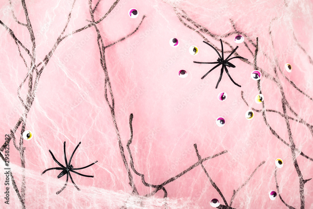 Pink halloween background with spider web, spiders and monster eyes ...