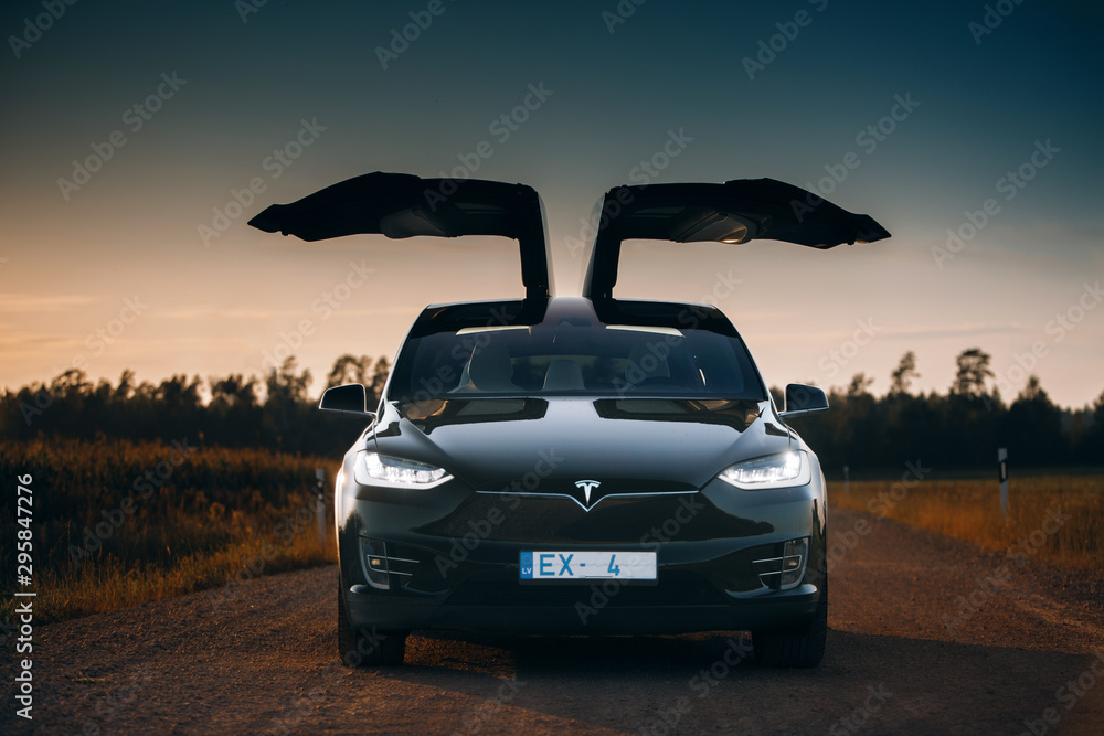 Tesla Model X P100D with falcon wings doors open in the evening. Tesla ...