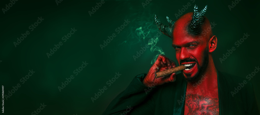 smoking red devil Stock Photo | Adobe Stock