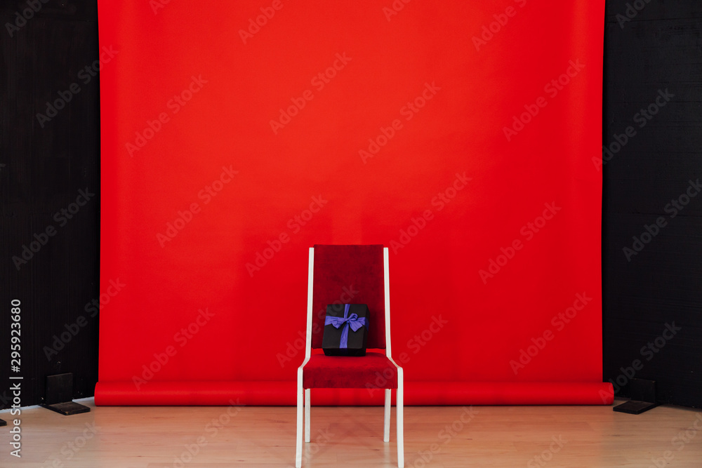 red black background room and one chair Stock Photo | Adobe Stock
