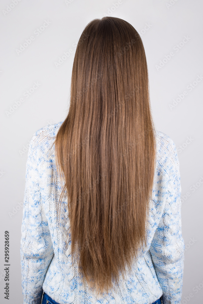 Vertical close up back behind rear view photo of woman demonstrating ...