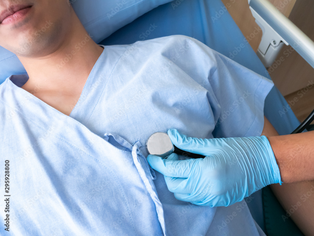 Professional doctor man listening heart rate pulse by stethoscope ...