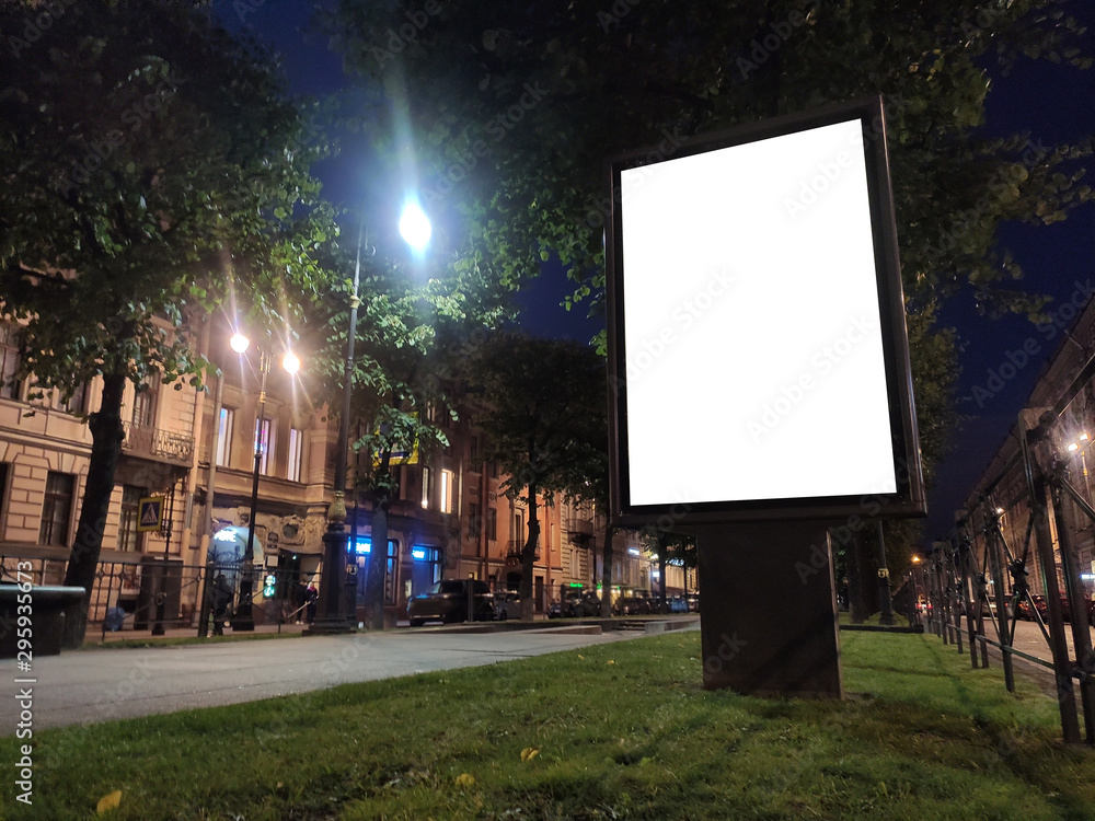 vertical small city billboard advertising city format. mockup at night ...