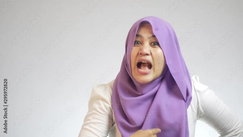 Angry muslim woman wearing hijab looking at camera with threatening ...
