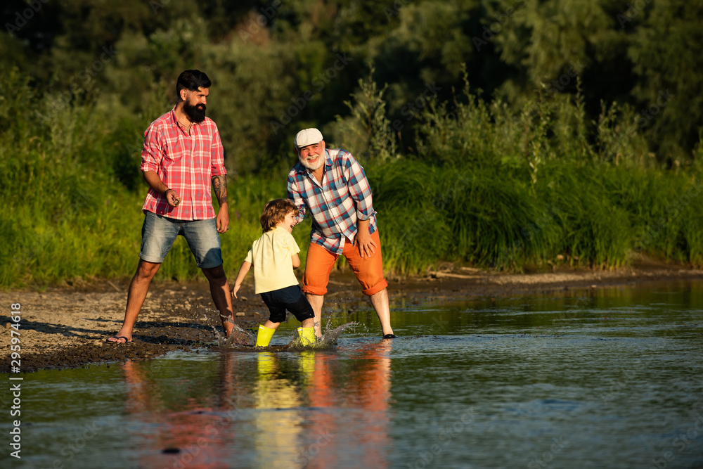 Three generation family. Skipping Stones with Dad adn Granddad. Three ...