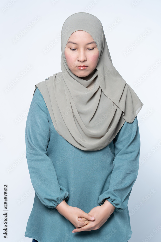 Muslim woman with sad facial expression. Stock Photo | Adobe Stock