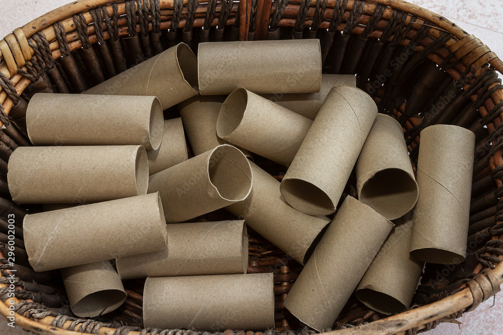 Group of empty tissue roll core put in the dark brown rattan wicker ...