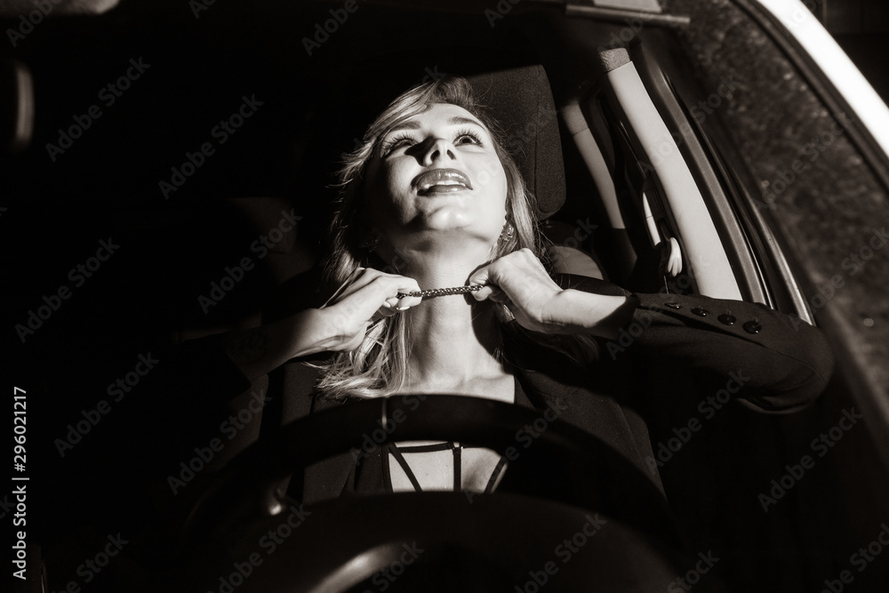 Scene from a detective series. Killer strangles business woman in her ...