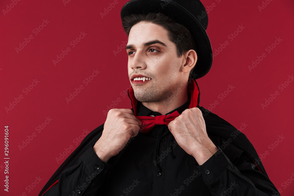 Image of vampire man with blood and fangs in black halloween costume ...
