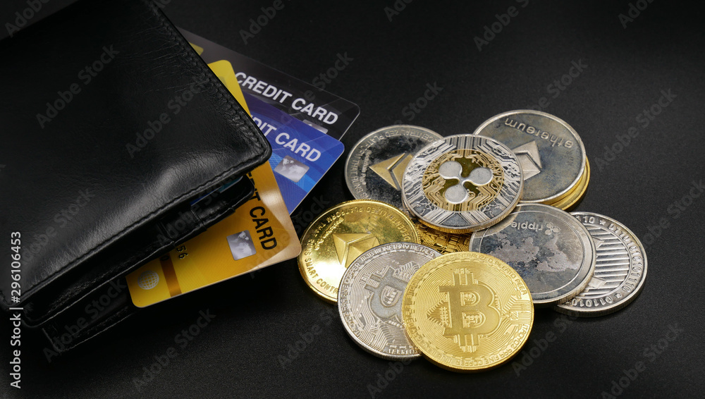 physical version of bitcoin and leather wallet and credit card that is ...
