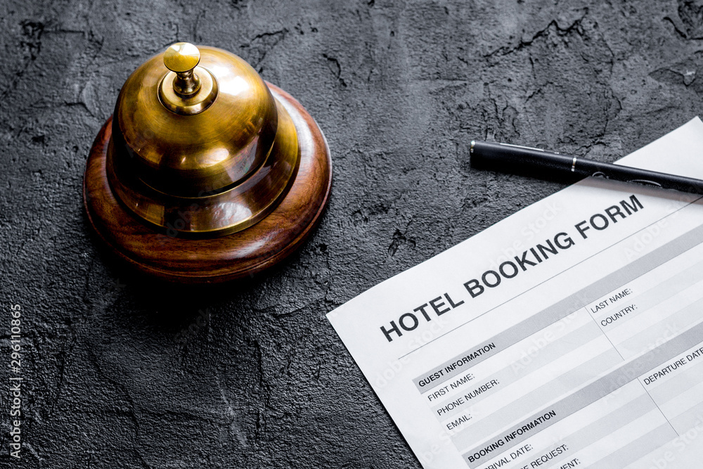 booking hotel room application form and ring dark desk background Stock ...