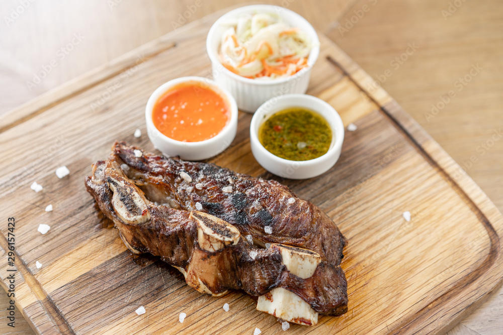 Beef meat cut according to the Argentine style, called asado. with ...