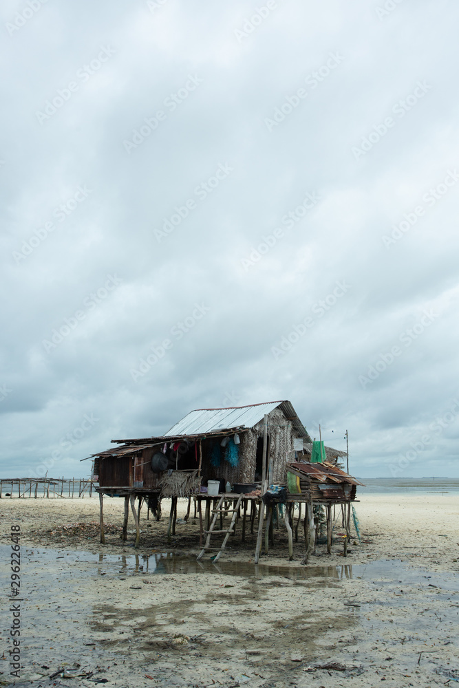 Poster A stilt house on a beach during lowtide in Tawi-Tawi in the ...