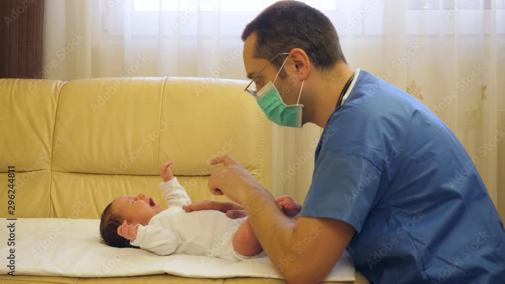 Friendly doctor consulting crying newborn baby child Stock ビデオ | Adobe ...