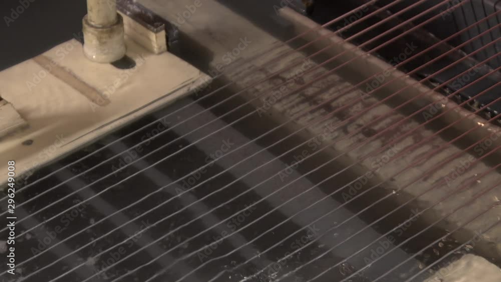 Production of wire by drawing technology. Wires pass through sulfuric ...