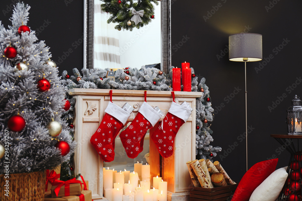 Fireplace with Christmas stockings in festive room interior Stock Photo ...
