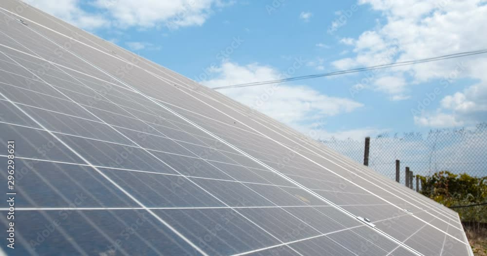 Extreme close up slide camera shot of the panels of small solar power ...