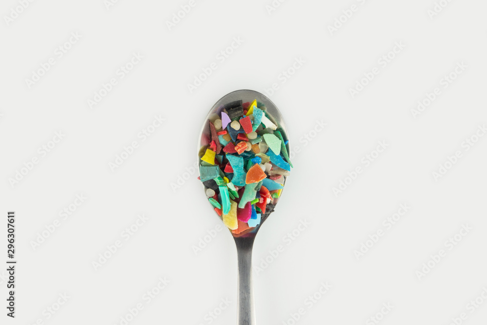 Spoon full of microplastics. Plastic pollution concept. Stock Photo ...