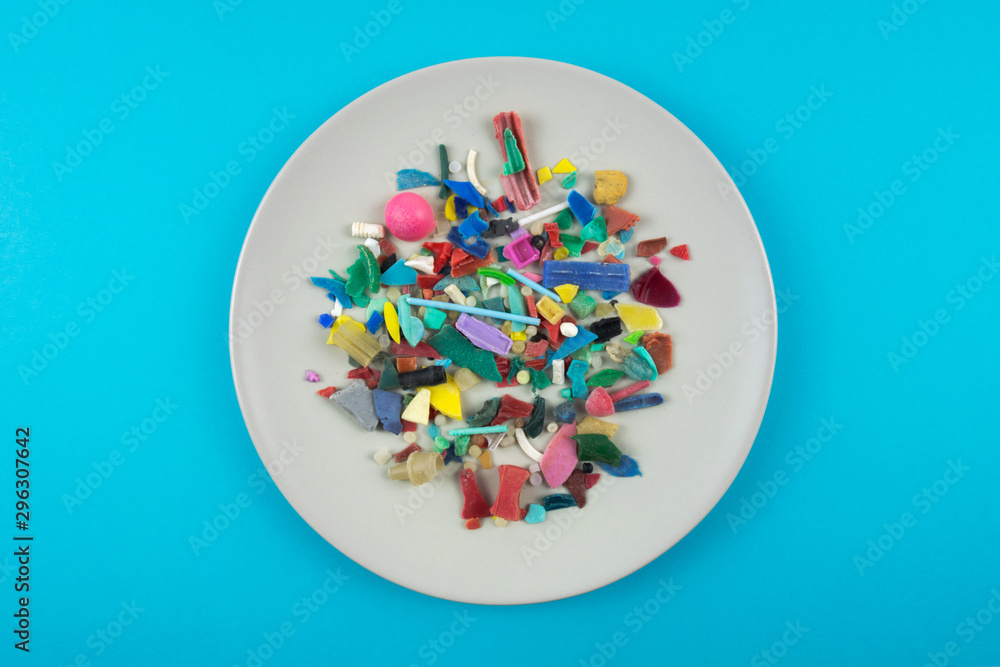 Plate full of microplastics. Plastic pollution concept. Stock Photo ...