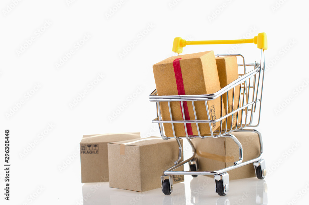Paper boxes in a trolley on white background. Ideas online shopping is ...