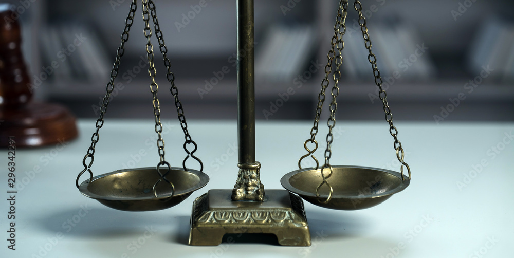 Scale of justice. Wooden judge`s gavel. The criminal law. Low concept ...