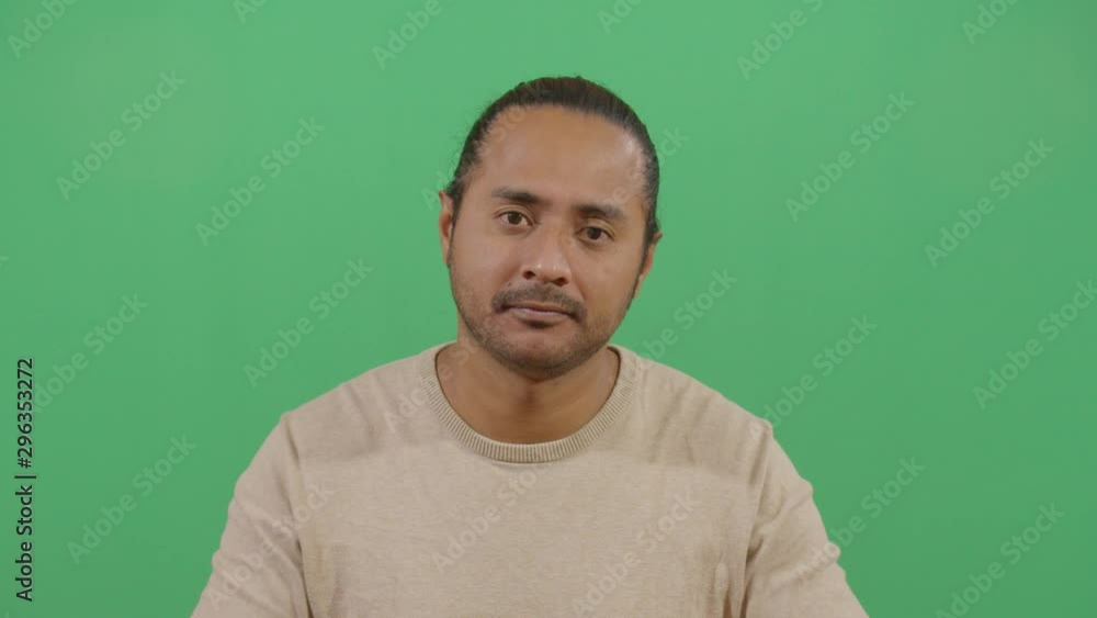 Adult Man Pinching Both Cheeks. Studio Isolated Shot Against Green ...