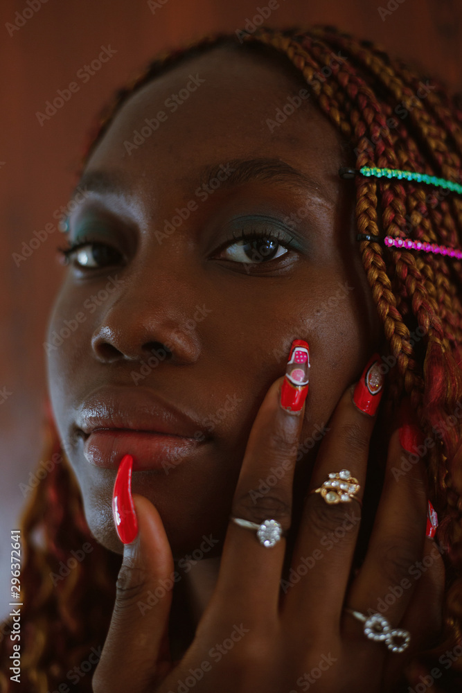 Woman holding up hand with nail designs and rings Stock Photo | Adobe Stock