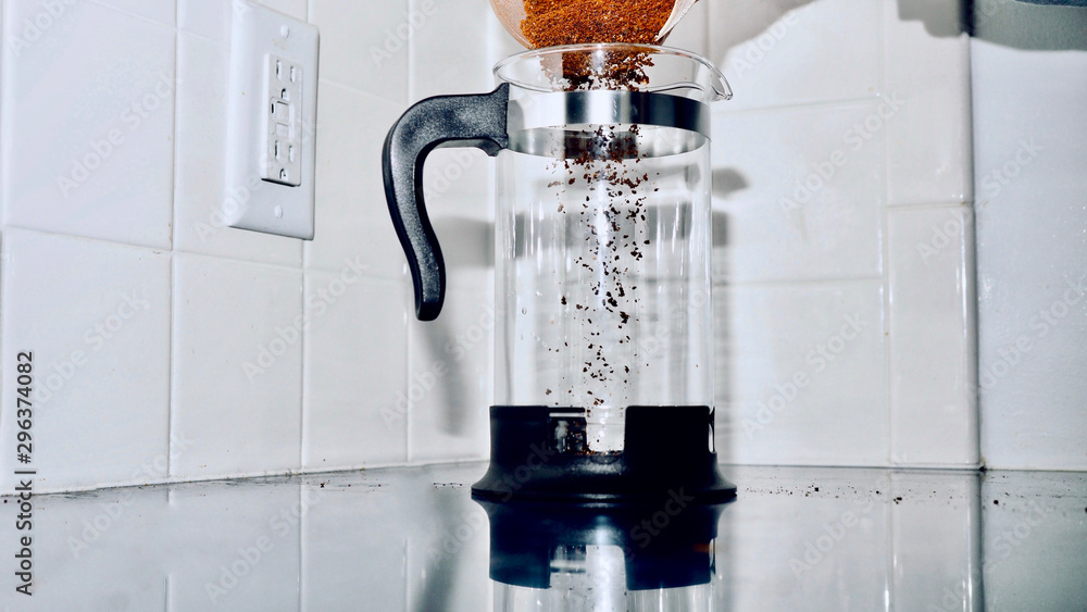 Coffee powder pouring into coffee maker Stock Photo | Adobe Stock