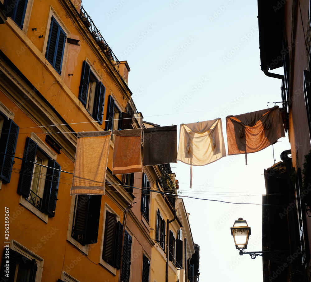 Clothes drying on clothes line in between building Stock Photo | Adobe ...