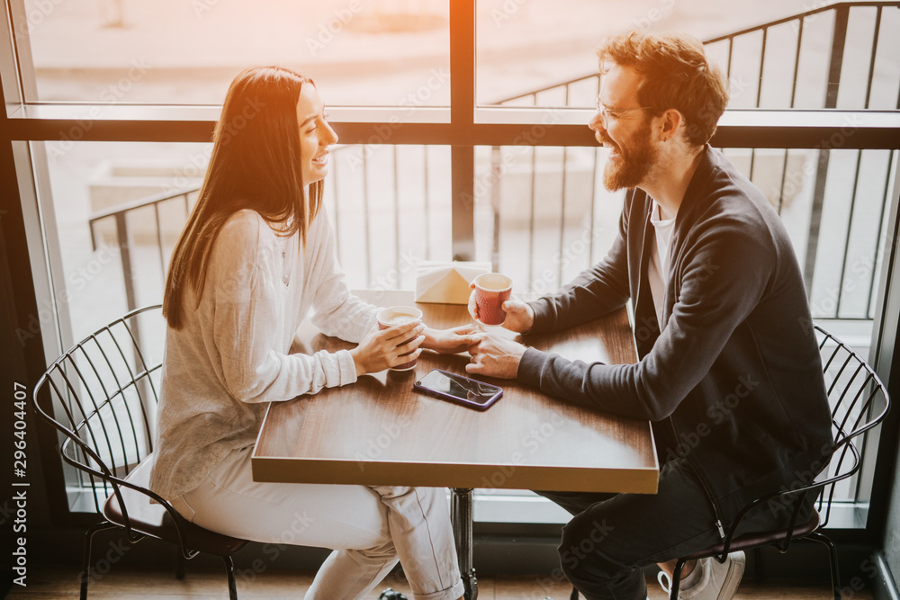 Cheerful young couple enjoying first date Stock Photo | Adobe Stock