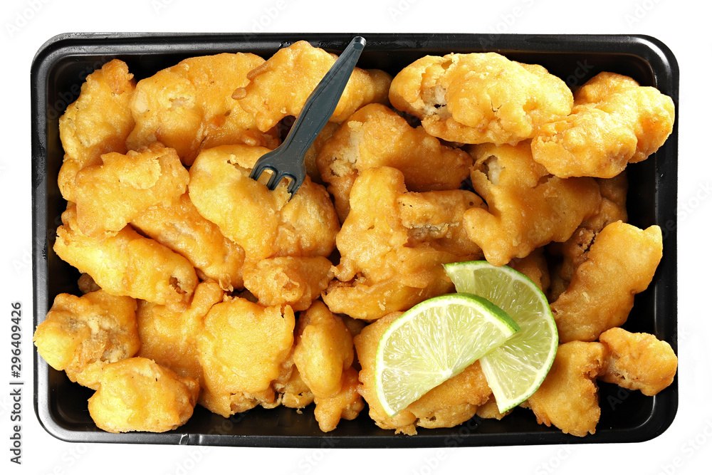 Kibbeling in a plastic tray isolated on white background. Kibbeling is ...