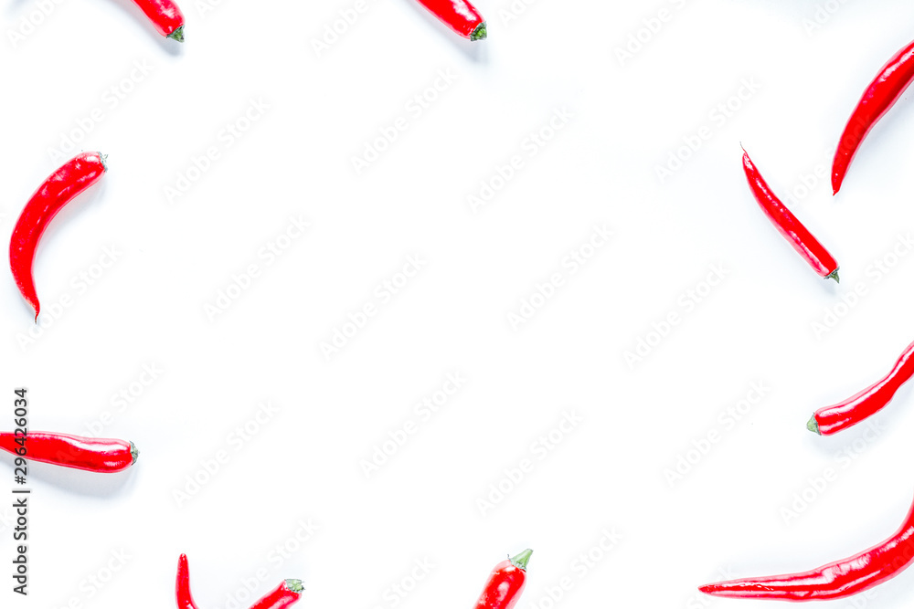 red chili pepper frame design on white table background top view mock ...